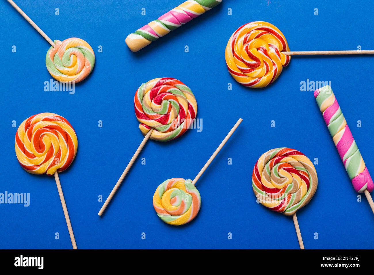 Set of colorful lollipops on colored background. Summer concept. Party ...