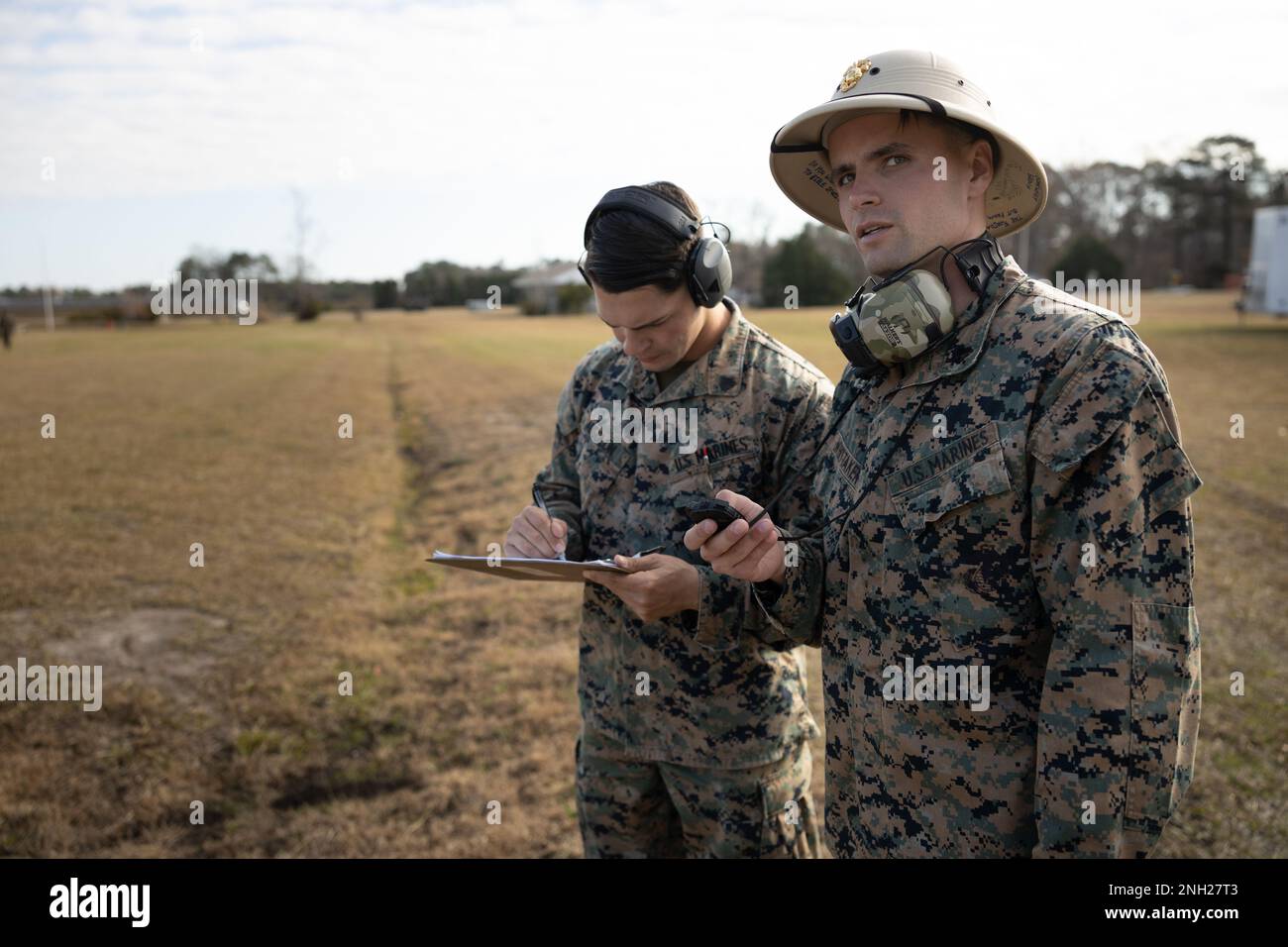 U.S. Marine Corps Cpl. Connar Whitaker, right, a range officer, and Sgt ...