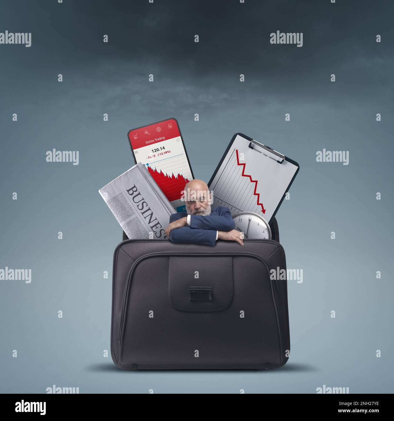 Stressed sad businessman and financial graphs showing loss in a ...