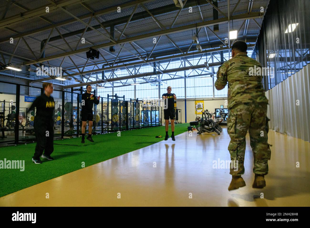 U.S. Soldiers assigned to the 39th Strategic Signal Battalion warm up ...