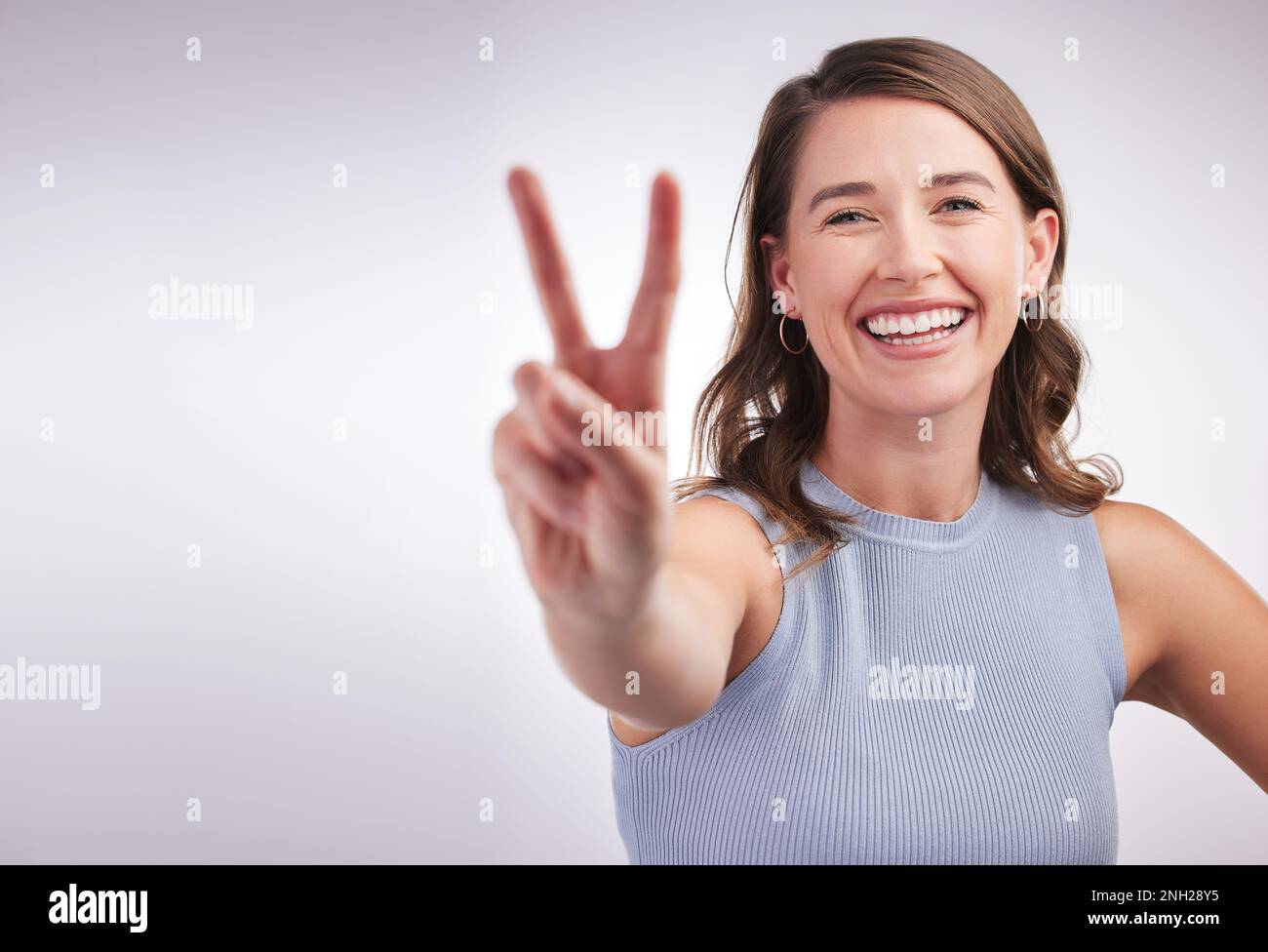 Spread love and peace wherever you go. Studio portrait of a young woman ...