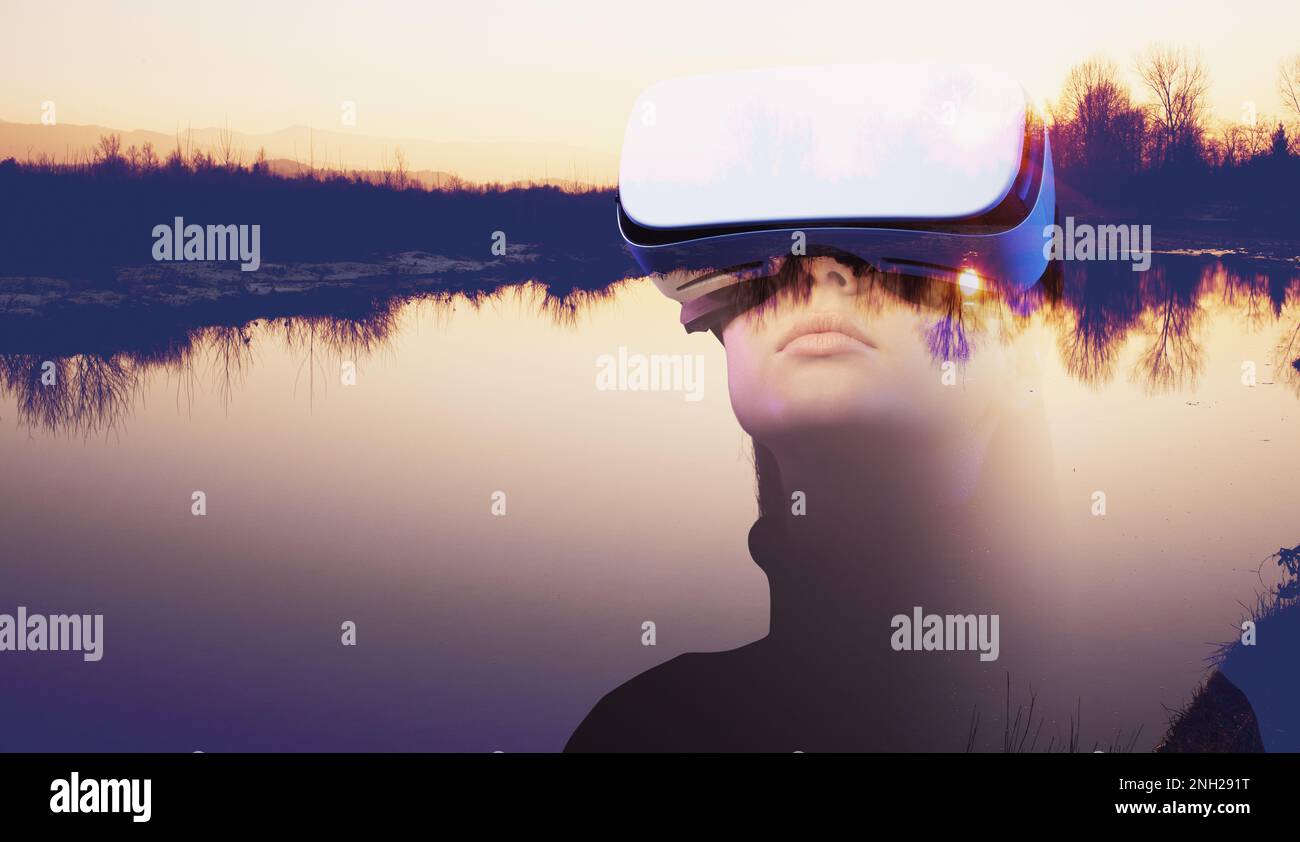 Woman viewing a beautiful natural panorama with river in VR, virtual ...