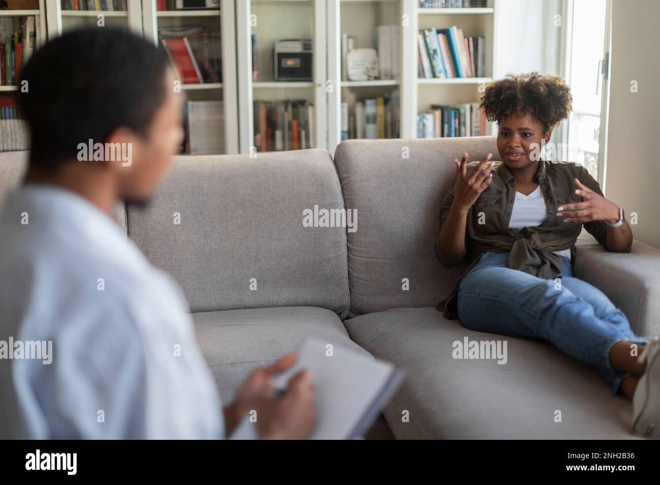 Emotional african american lady having therapy session with ...