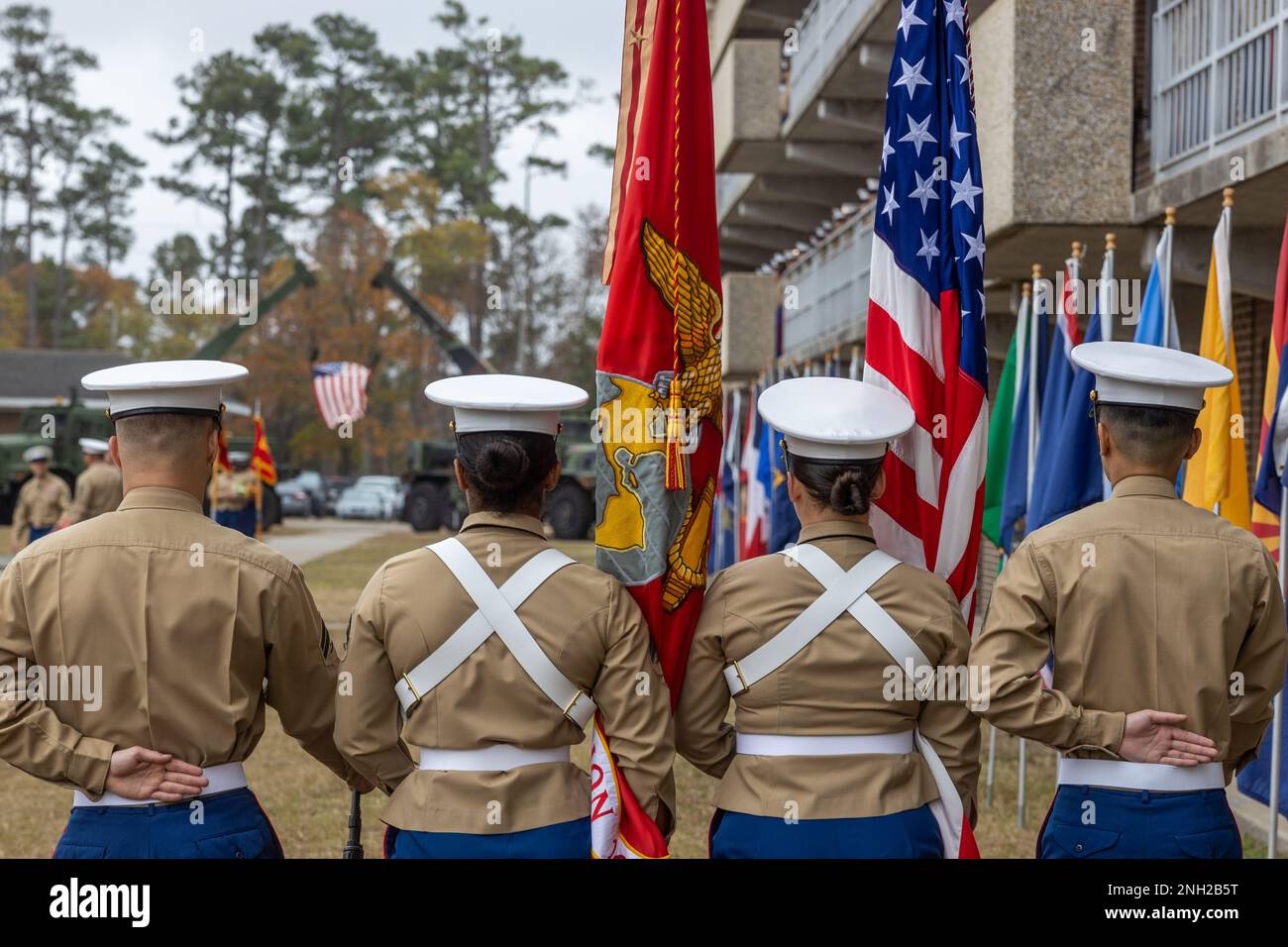 U.S. Marines with the Combat Logistics Battalion 26 color guard stand ...