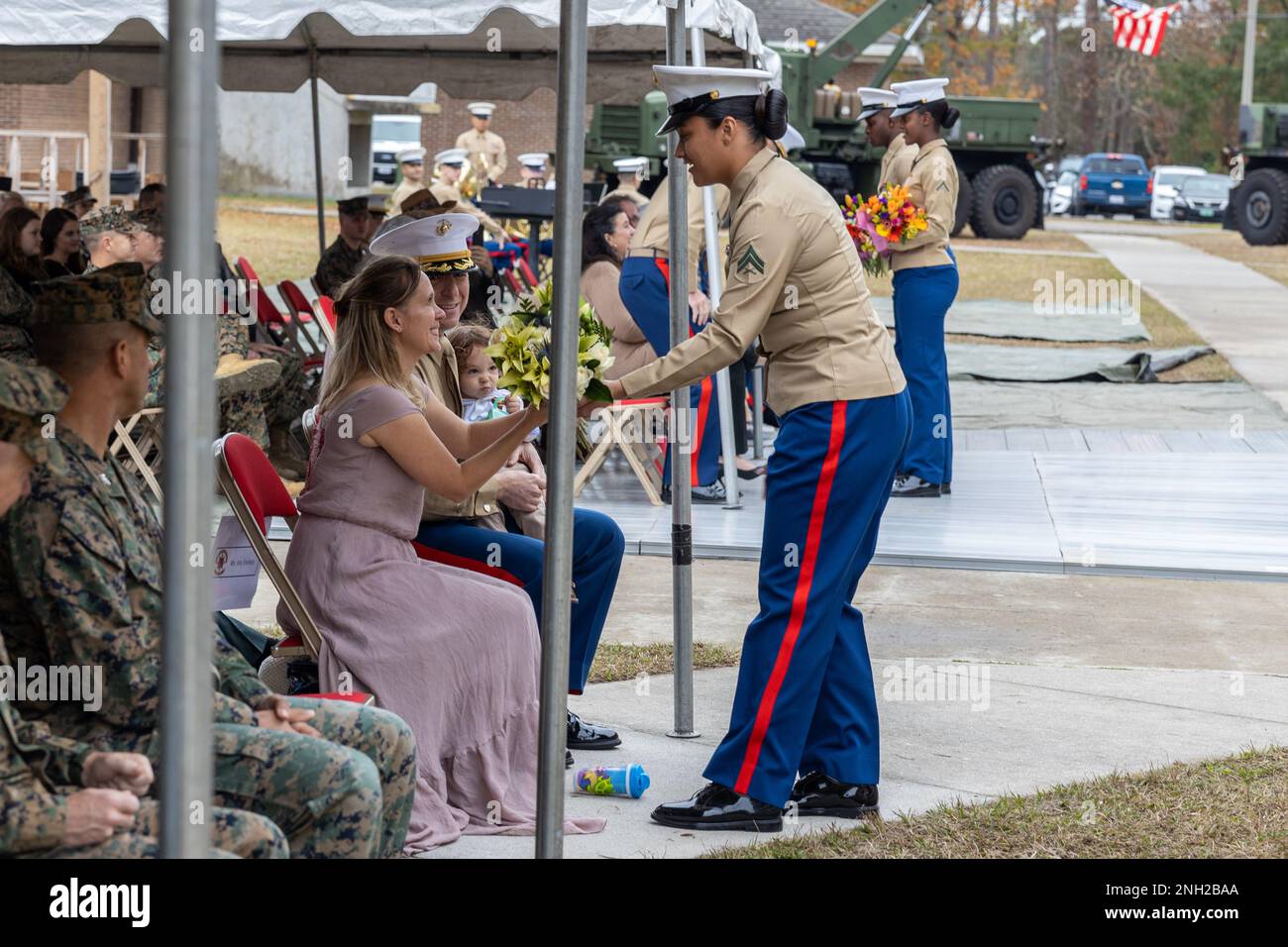 Flowers are presented to family members of Lt. Col. Harold J. Everhart ...