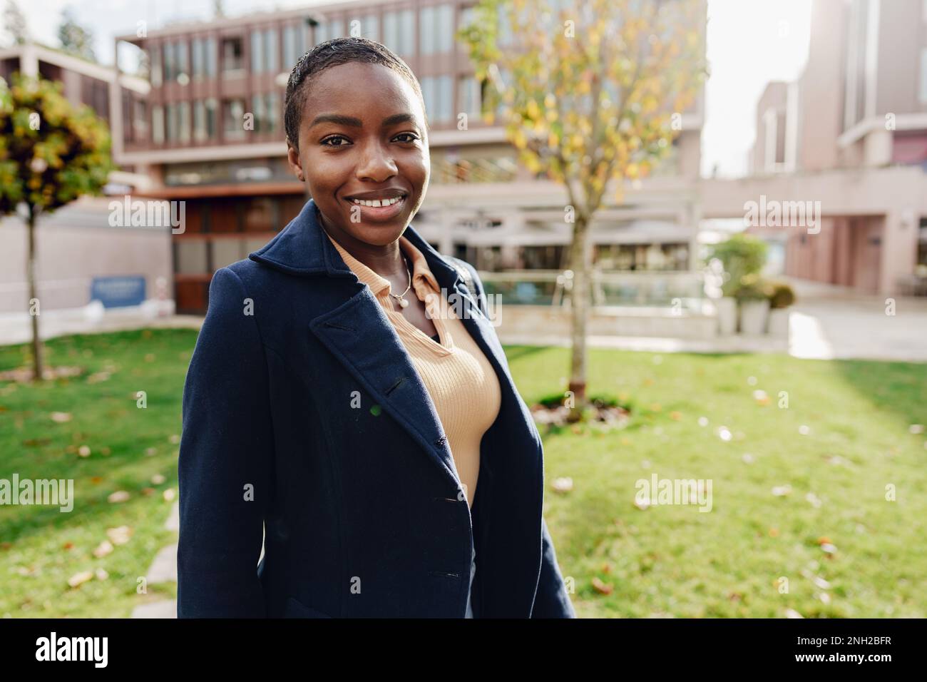 Stylish african female student near university campus Stock Photo - Alamy