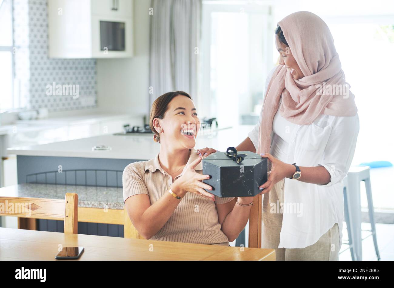 Congratulations my beautiful friend. a young woman giving her friend a ...