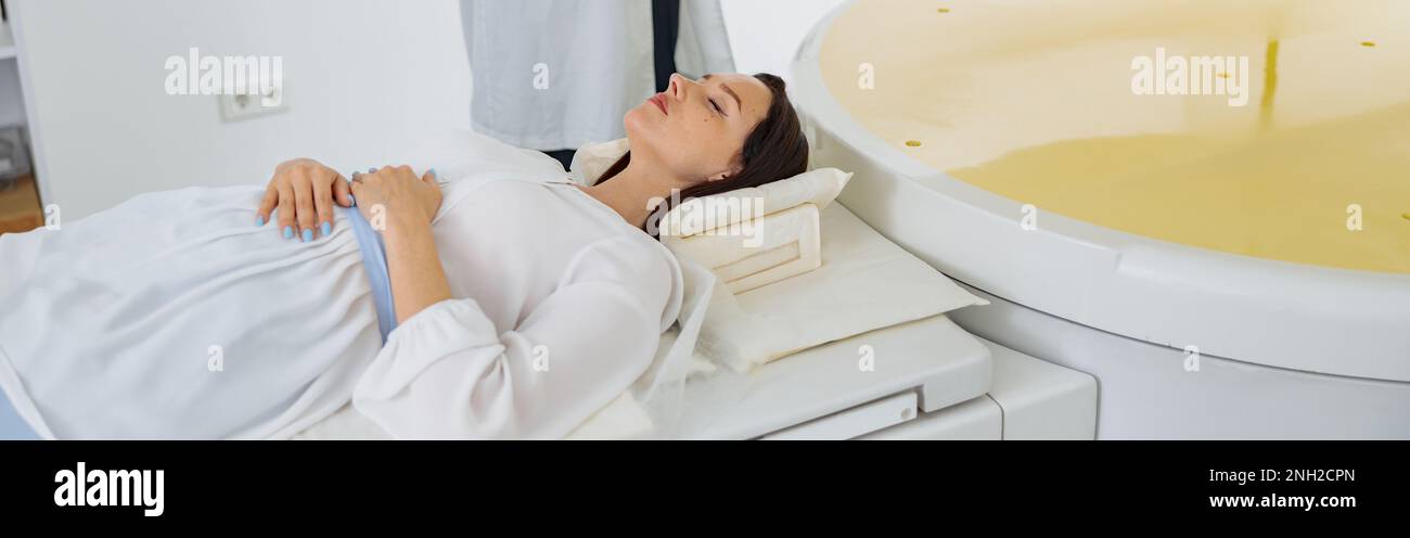 Woman patient is ready to do magnetic resonance imaging MRI or CT scan ...