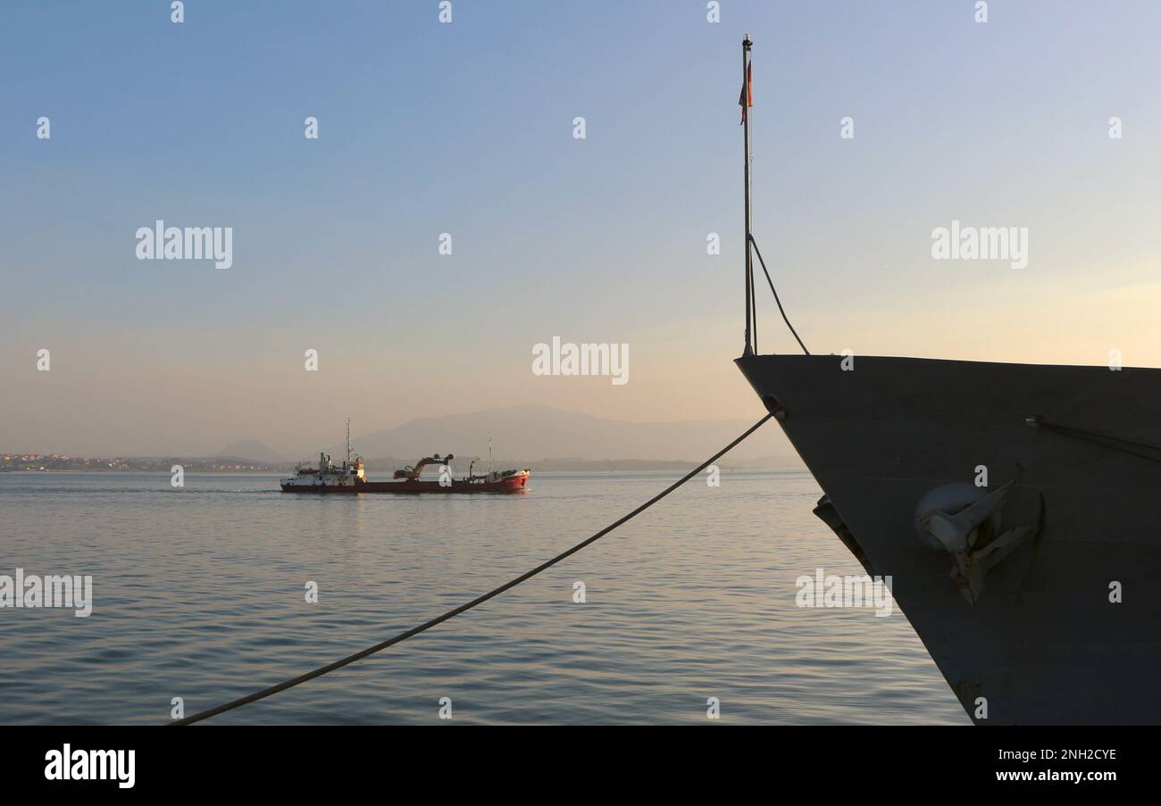 Hopper Dredger ship Omvac Cinco passing the bow of the Spanish Navy ...