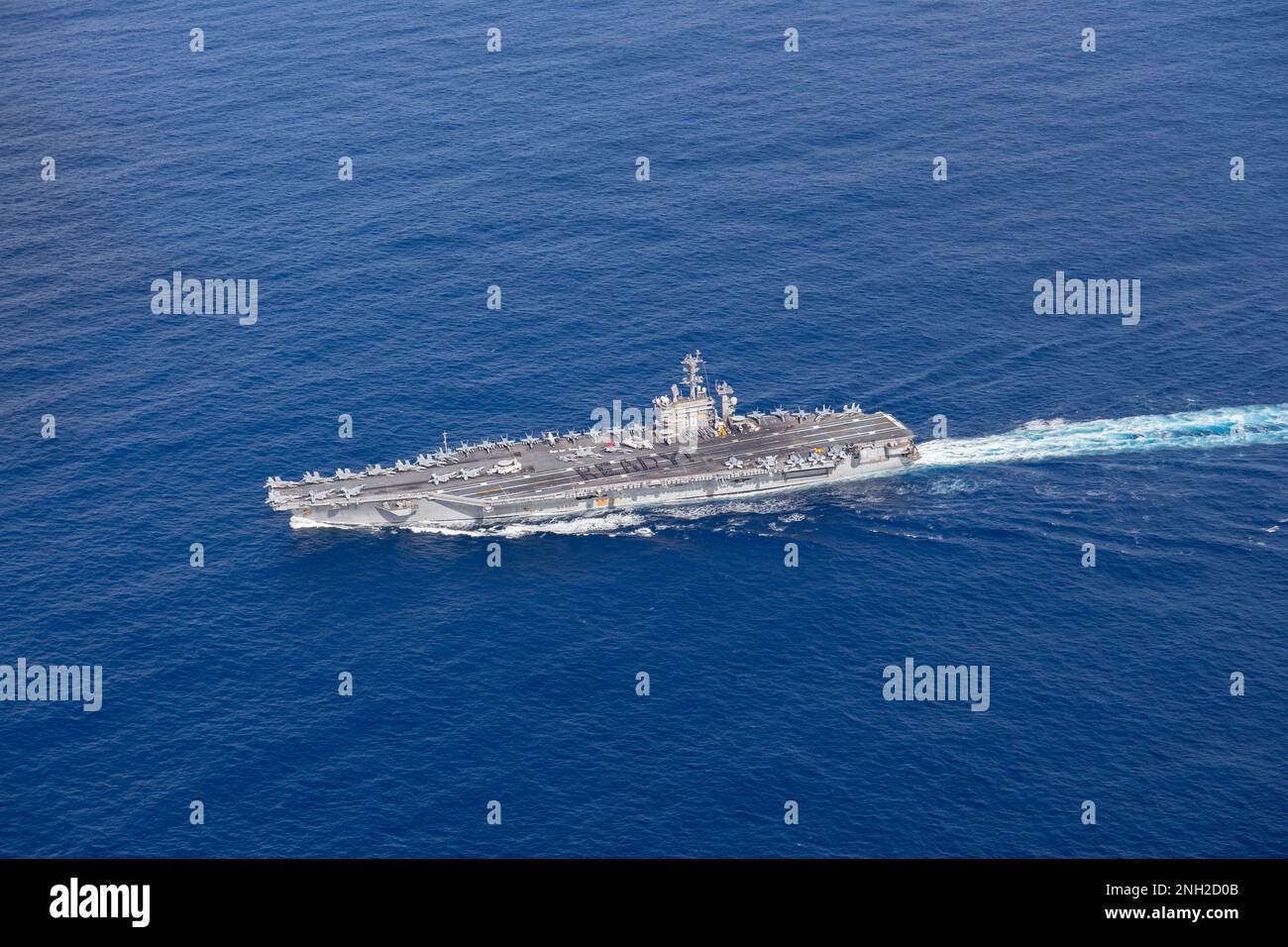221208-N-ZQ263-1082 PACIFIC OCEAN (Dec. 8, 2022) U.S. Navy Sailors form ...