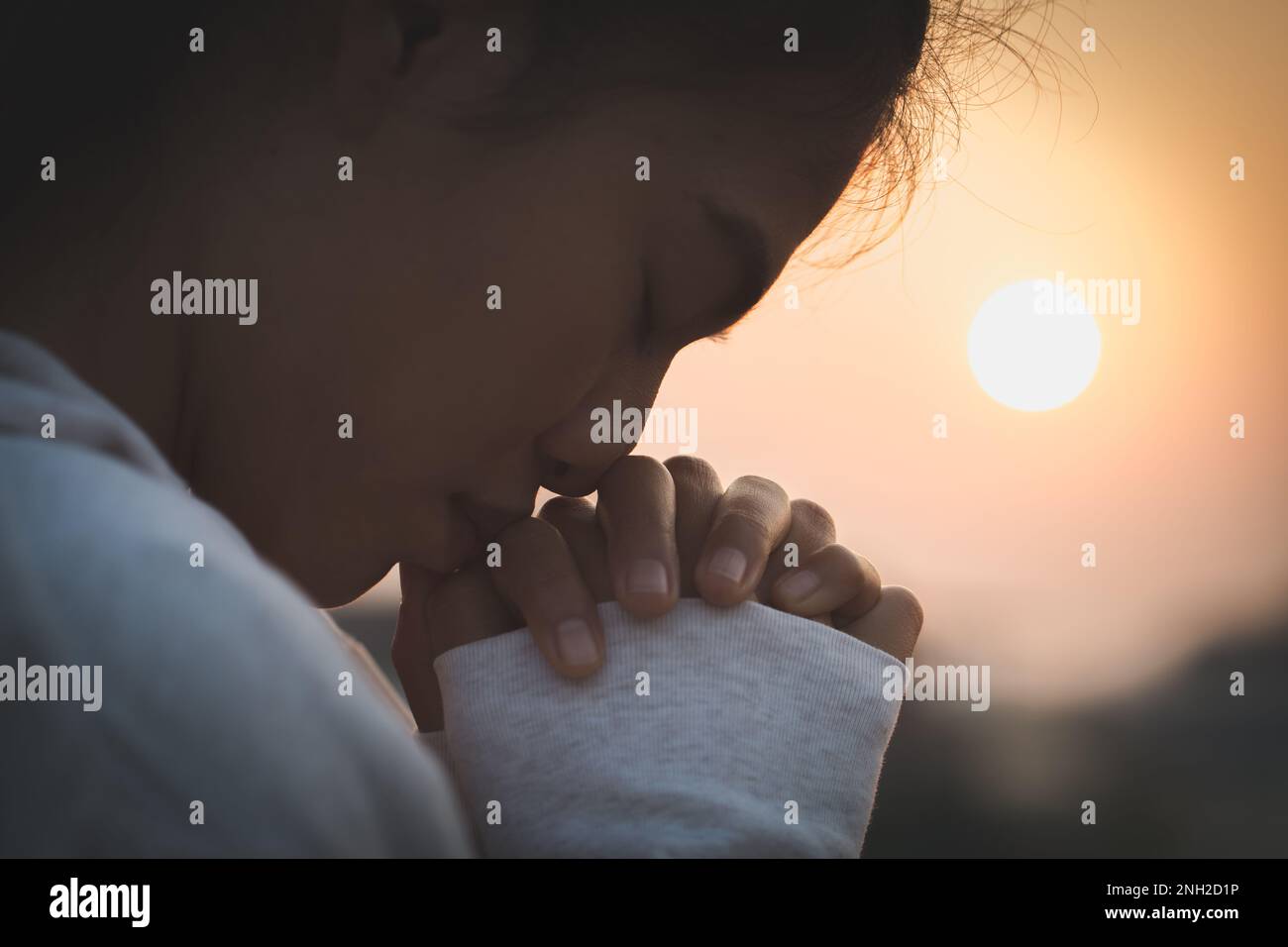 Pray in the Morning , Woman praying with hands together on the morning ...