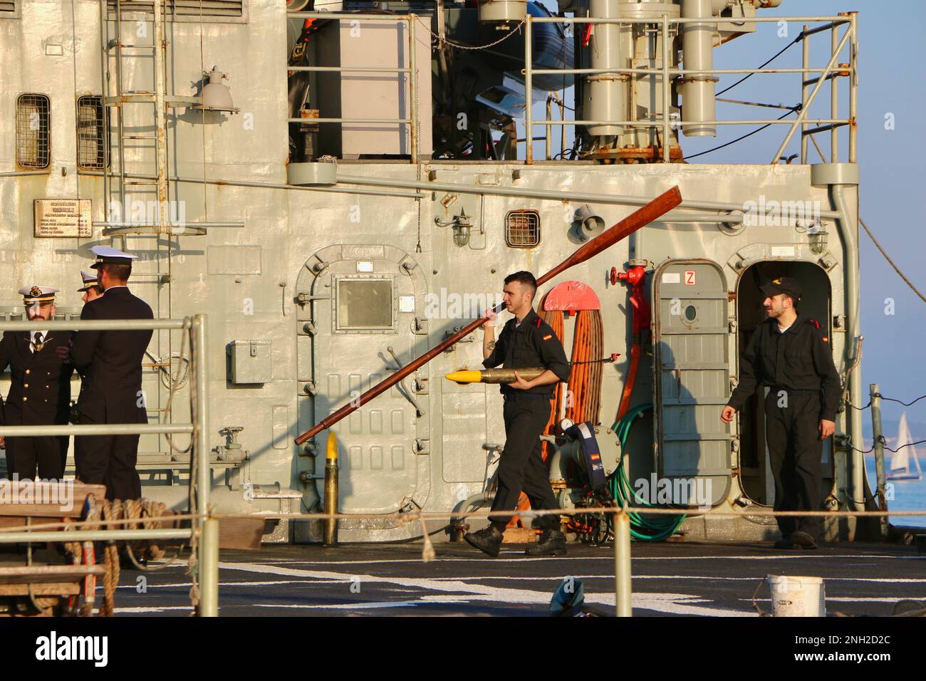 Sailor carrying a shell and an oar for the entrance to an open day on ...