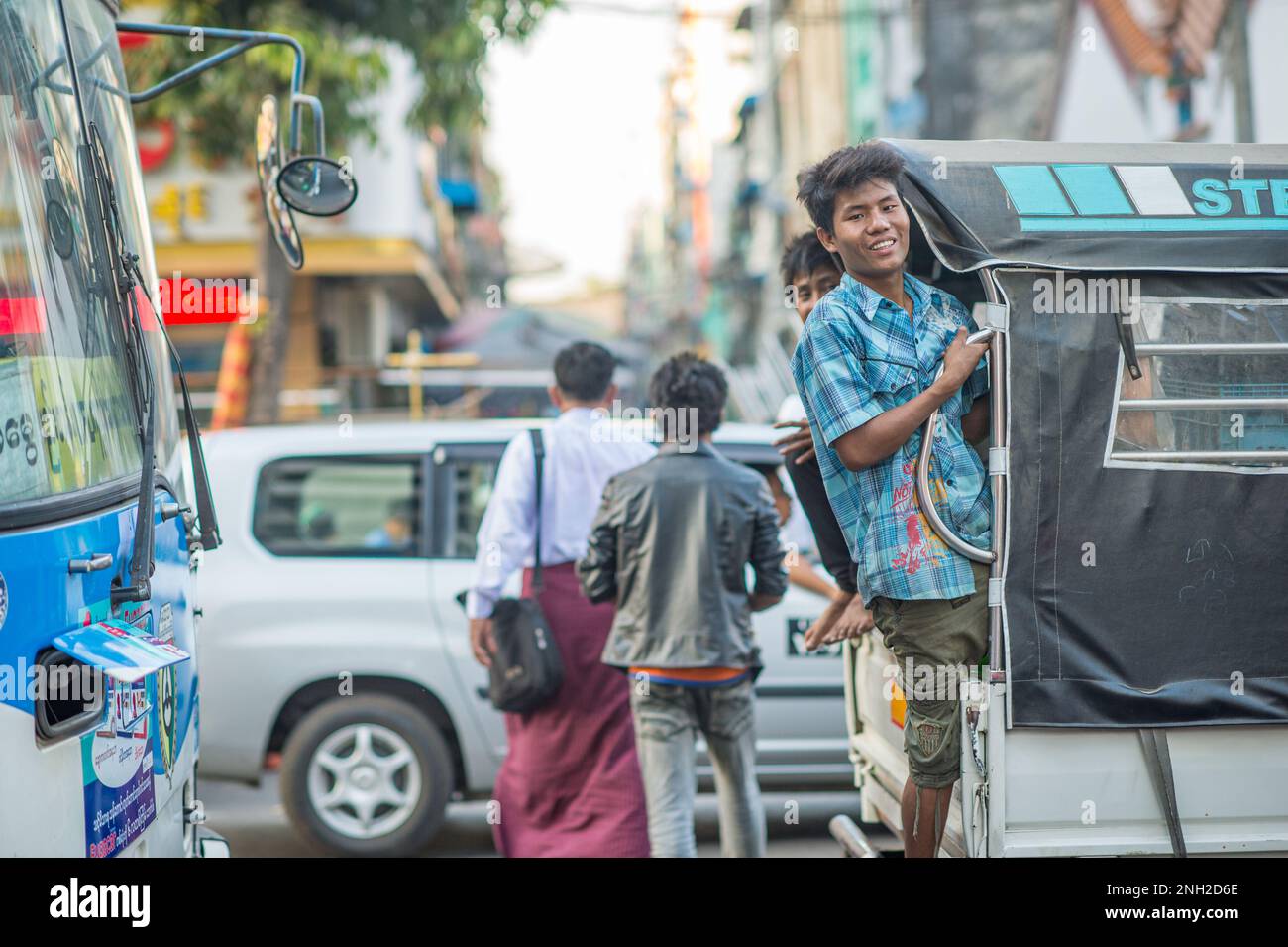 Urban scene from Maha Bandoola Road in Chinatown of Yangon. Myanmar is ...