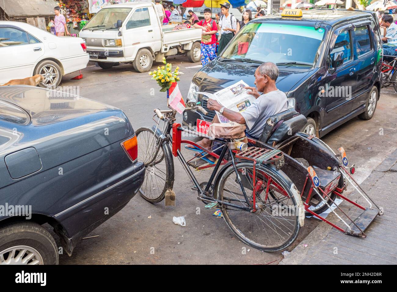 Urban scene from Maha Bandoola Road in Chinatown of Yangon. Myanmar is ...