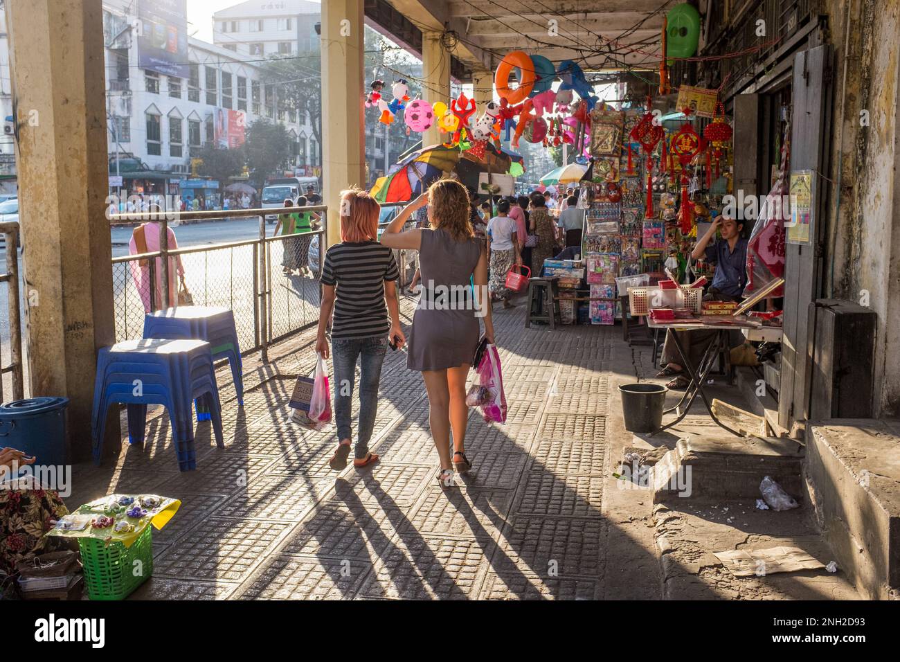 Urban scene from Maha Bandoola Road in Chinatown of Yangon. Myanmar is ...