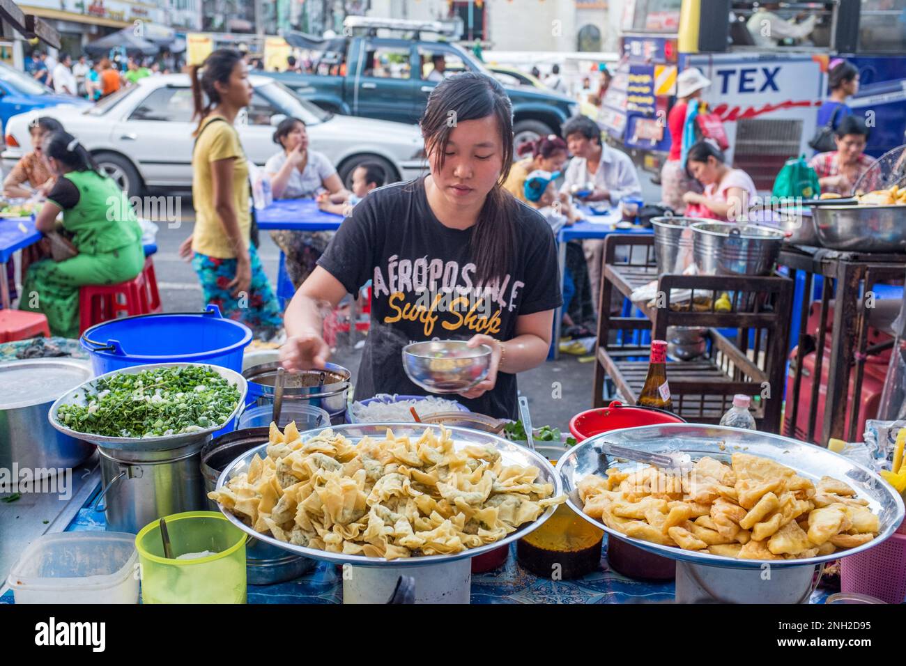 Urban scene from Maha Bandoola Road in Chinatown of Yangon. Myanmar is ...