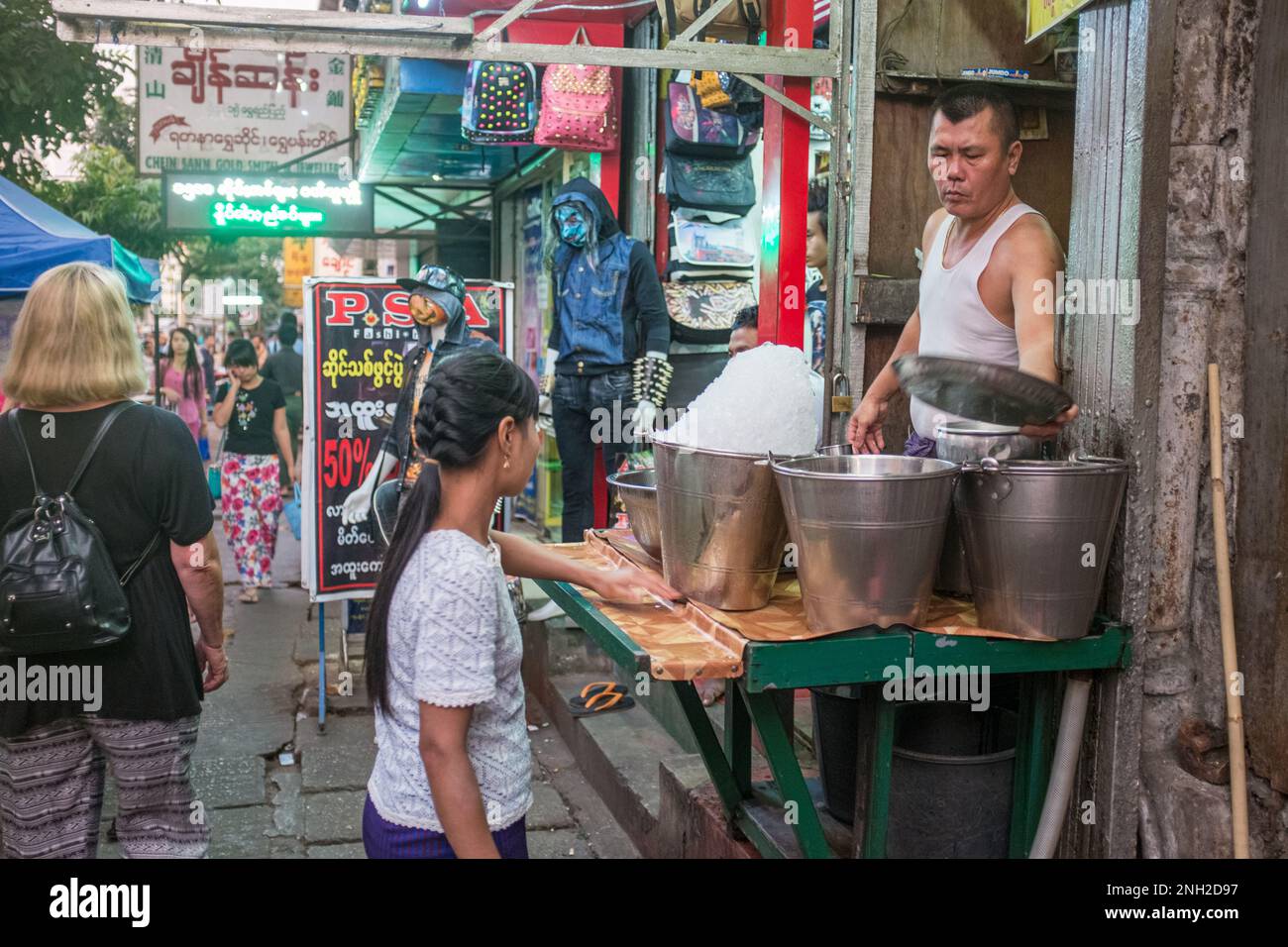 Urban scene from Maha Bandoola Road in Chinatown of Yangon. Myanmar is ...