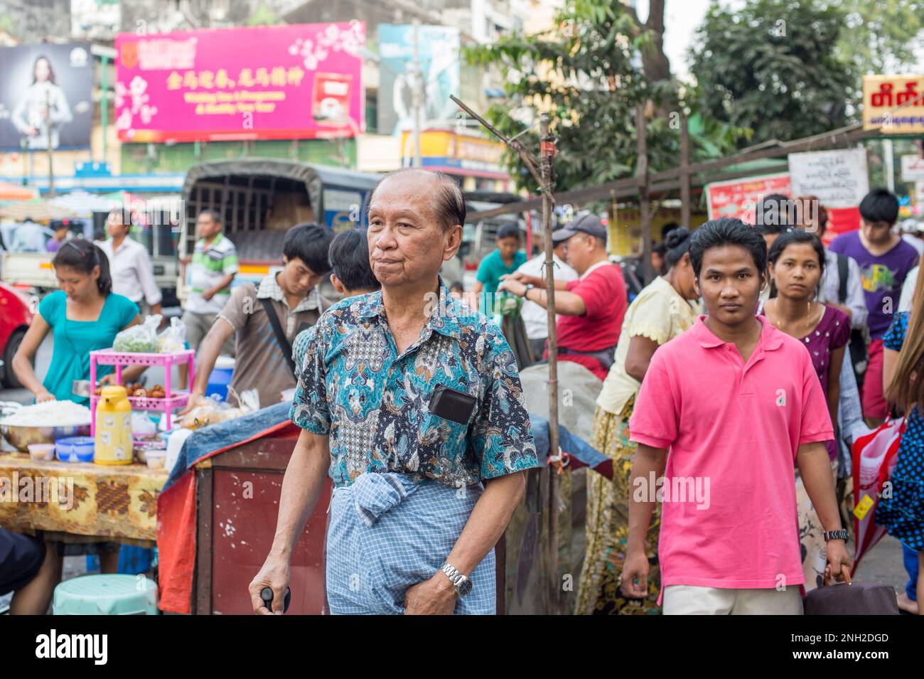 Urban scene from Maha Bandoola Road in Chinatown of Yangon. Myanmar is ...