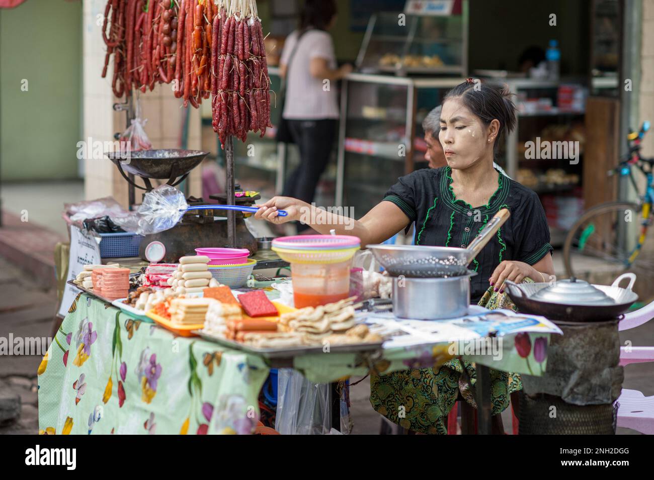 Urban scene from Maha Bandoola Road in Chinatown of Yangon. Myanmar is ...