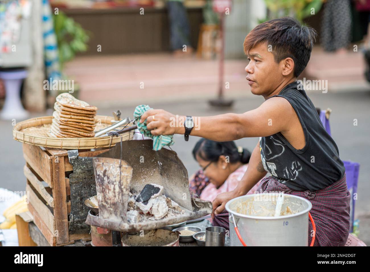 Urban scene from Maha Bandoola Road in Chinatown of Yangon. Myanmar is ...