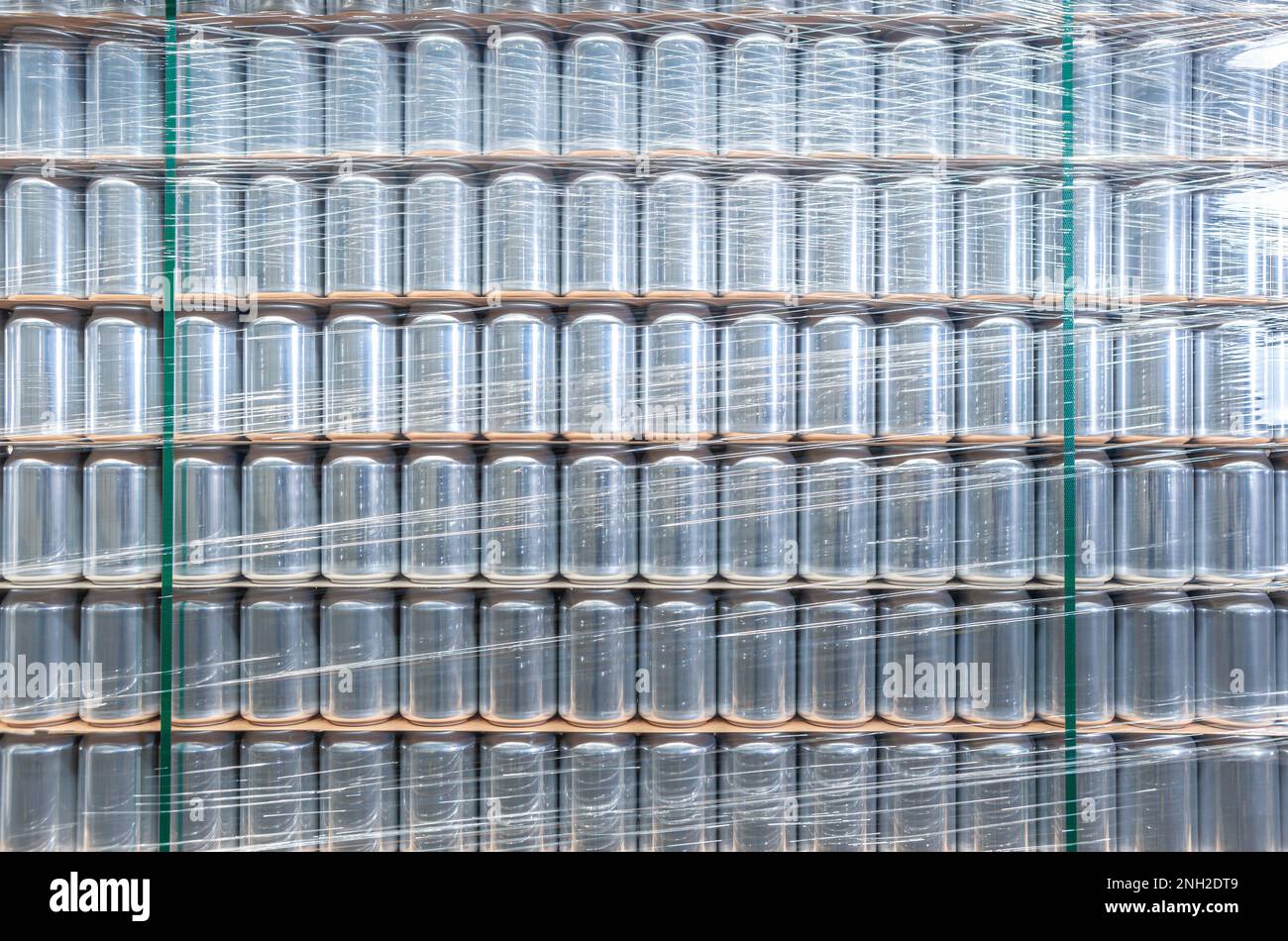 Stack of new aluminum cans for cold beverages. Big pallet of metal ...