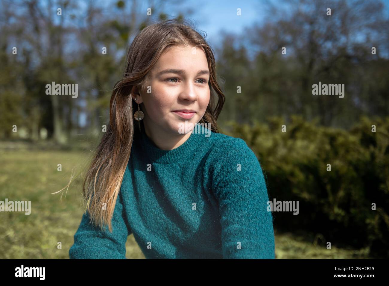 Teenage girl in spring park. Portrait of beautiful teenage caucasian ... Teenage girl in spring park. Portrait of beautiful teenage caucasian ...