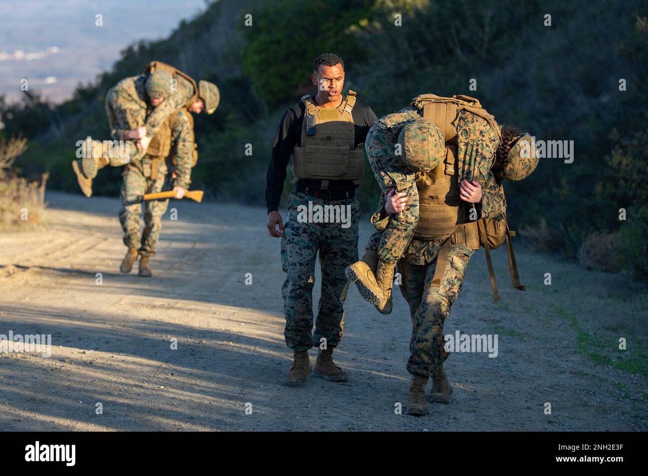 U.S. Marine Corps Staff Sgt. Adrian Smith, center, a martial arts ...
