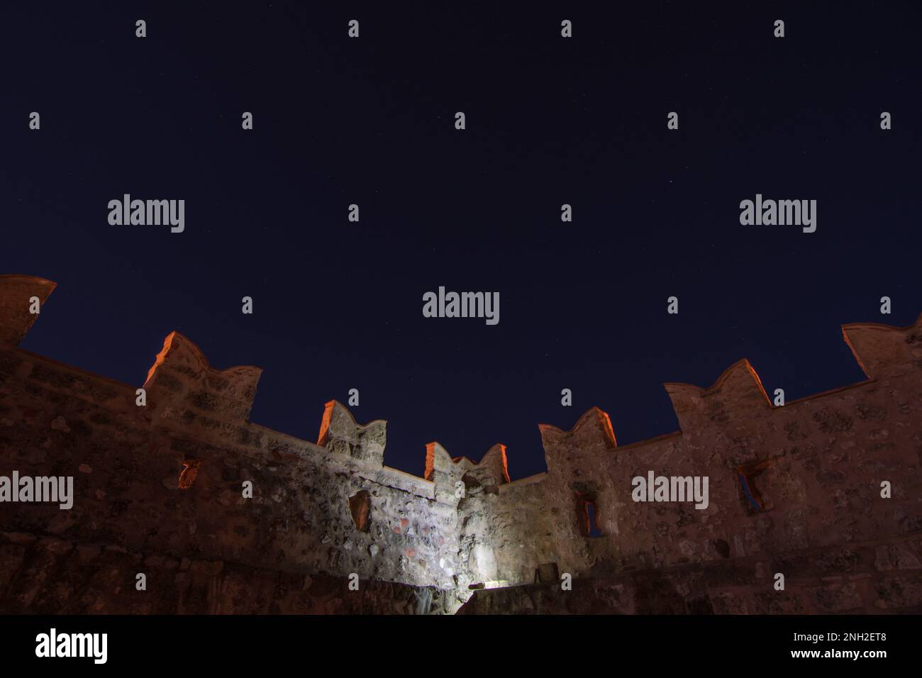 Night view of crenellated walls of La Grua-Talamanca castle, Carini ...