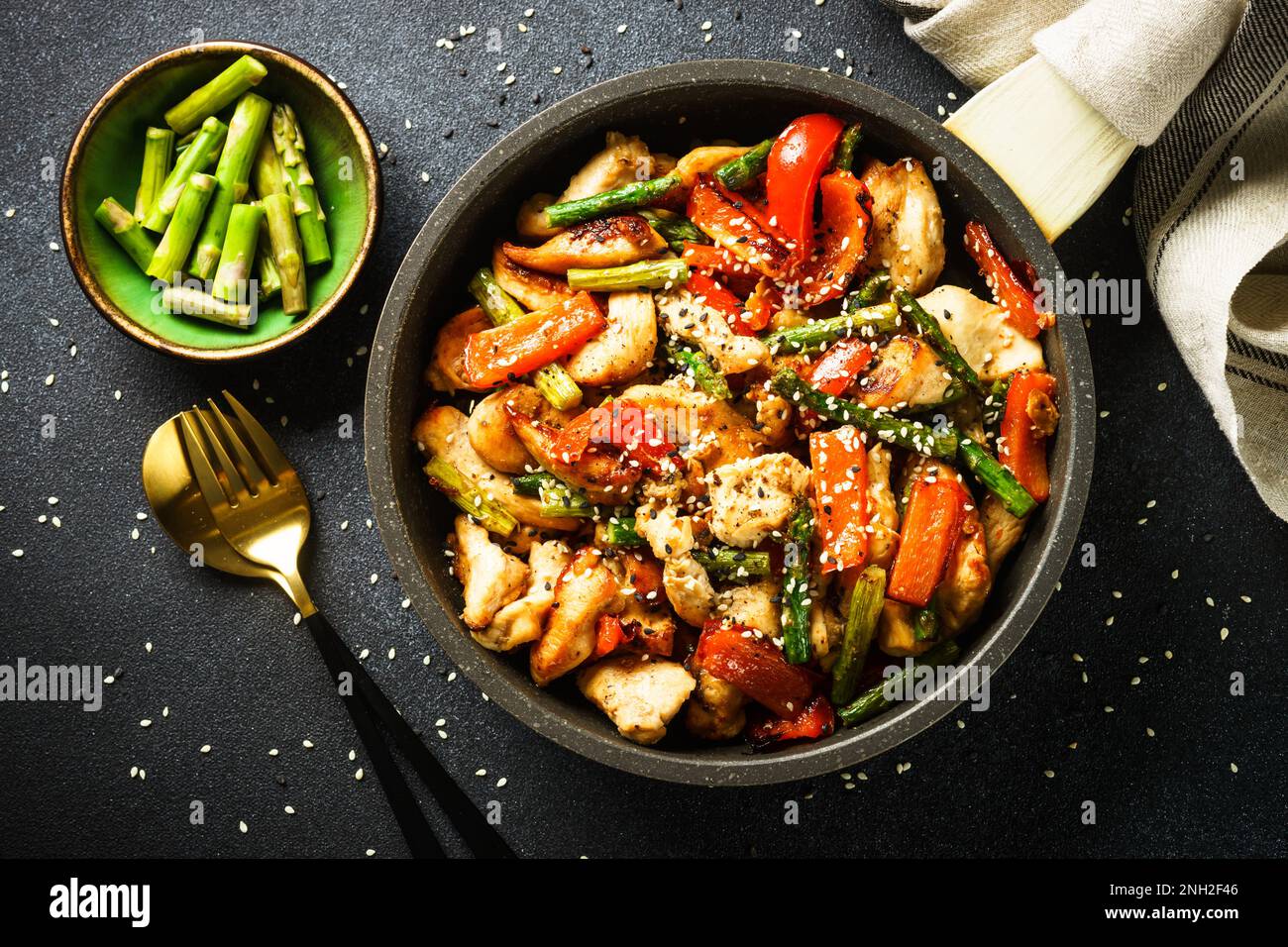 Chicken stir fry with vegetables at stone background Stock Photo - Alamy