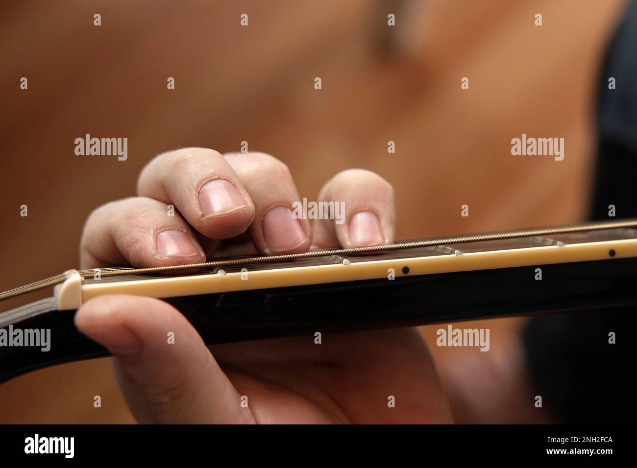 Playing the guitar. Strumming black acoustic guitar. Musician plays ...