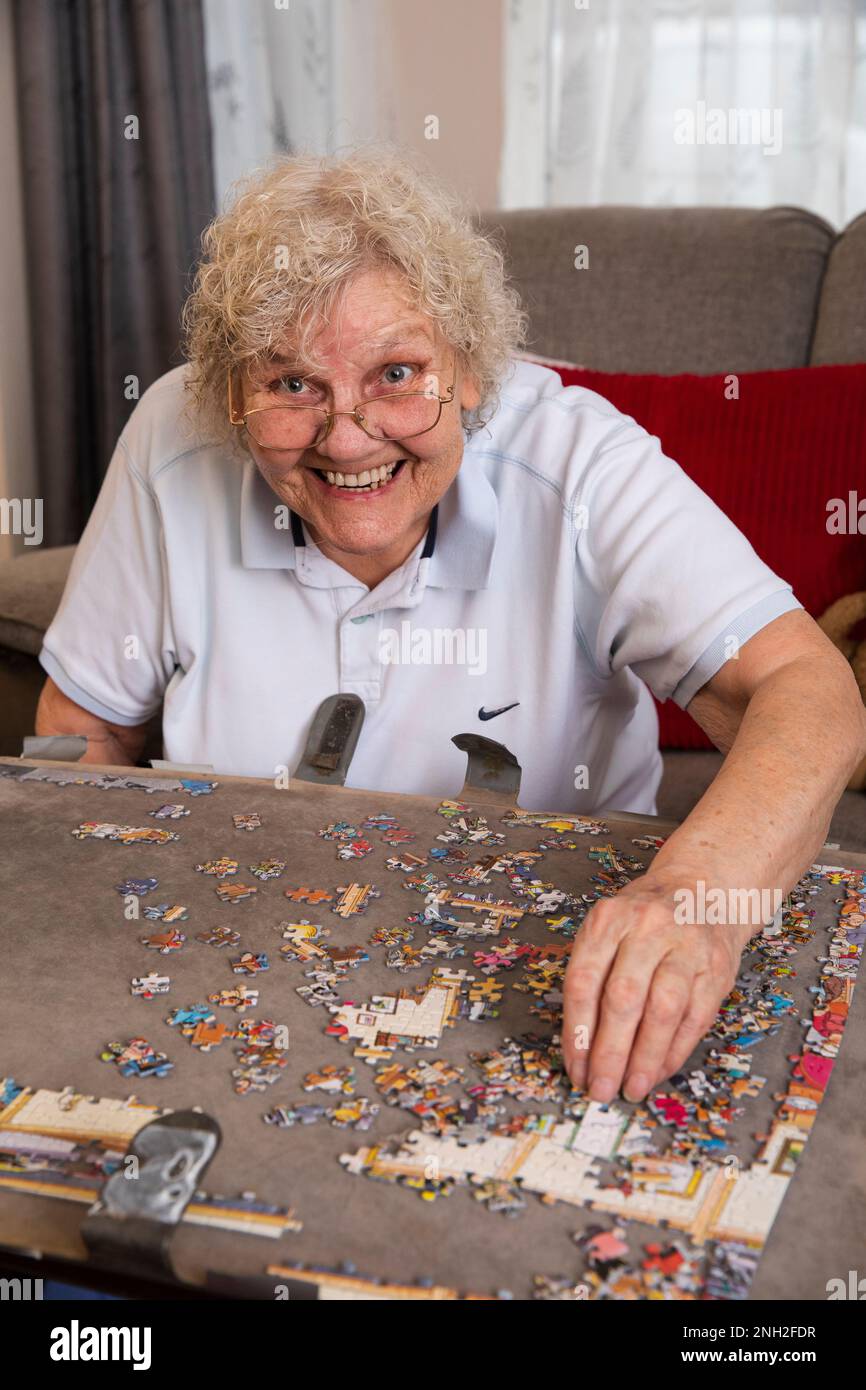 Doing a puzzle hi-res stock photography and images - Alamy