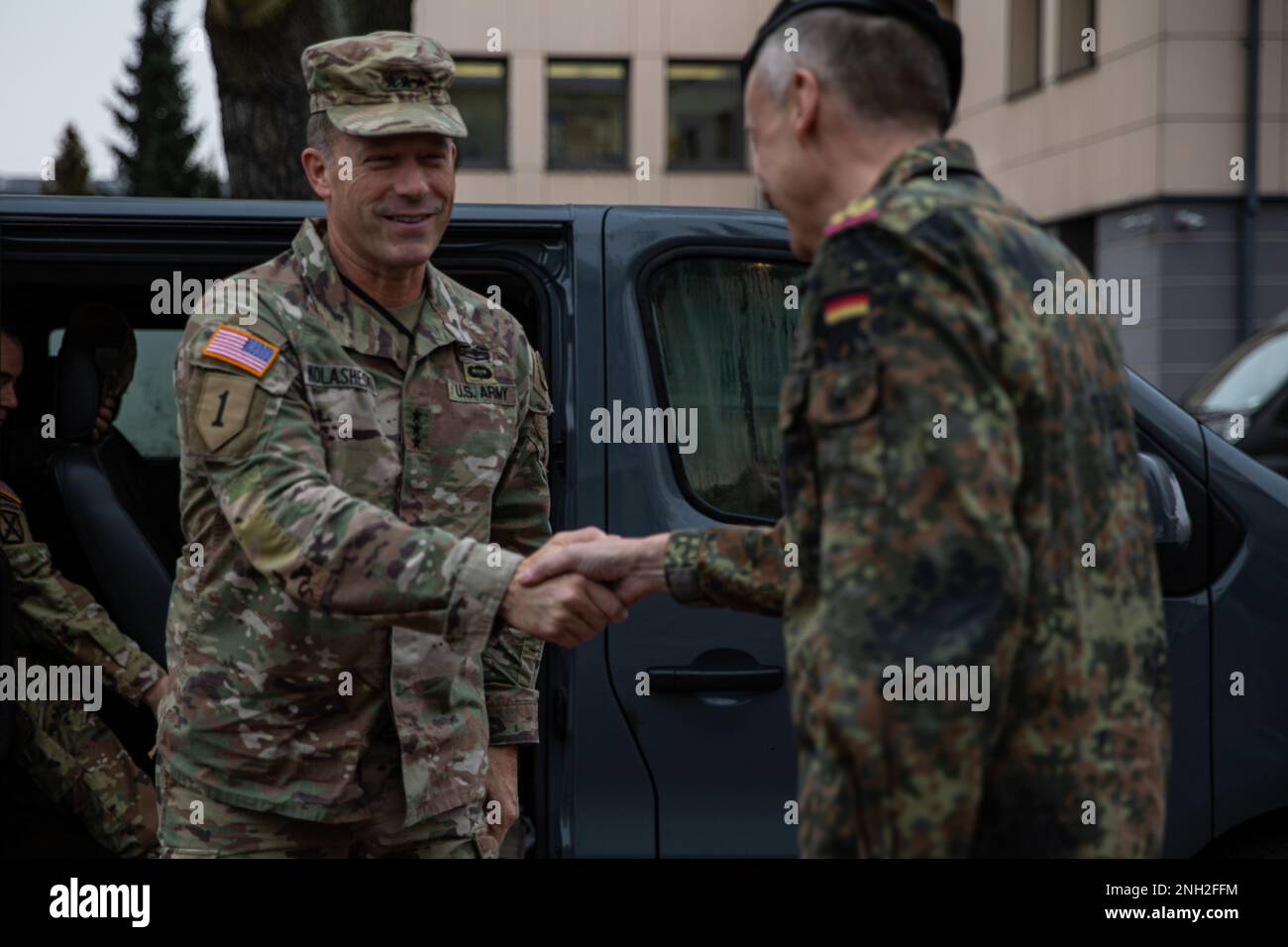 Lt. Gen. John S. Kolasheski, V Corps commanding general, is greeted by ...