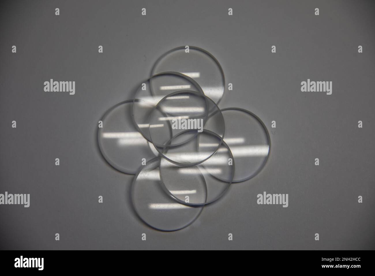 optical glasses as magnifying glasses in a heap show light reflections ...