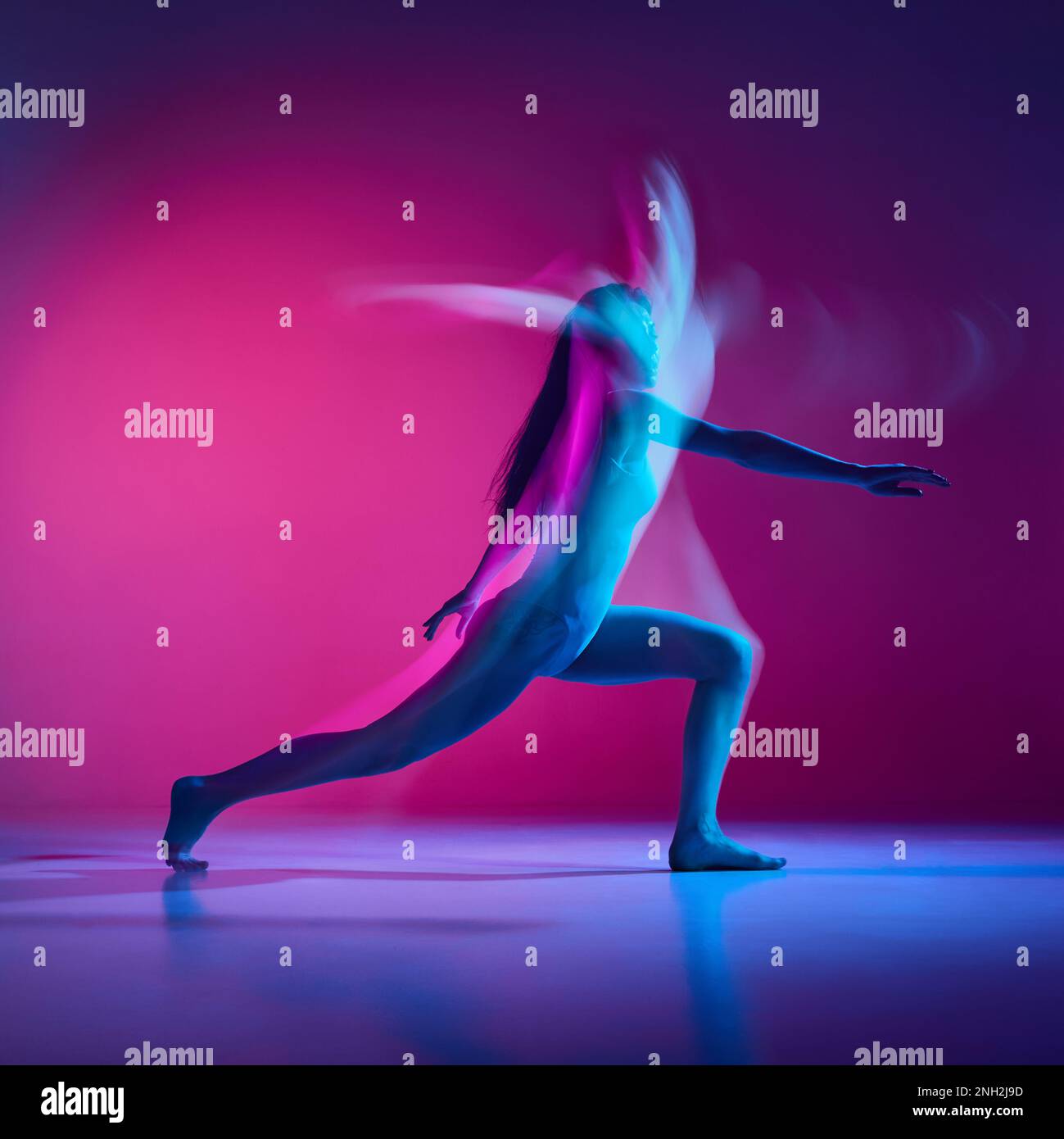 Expressive contemp. Young woman dancing in bodysuit over gradient pink ...