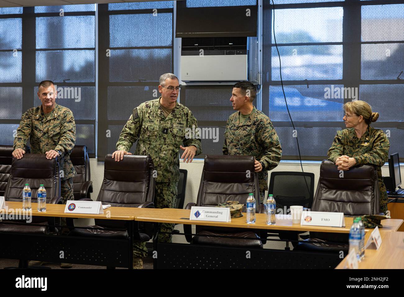 U.S. Navy Rear Adm. James Kirk, center left, the commander of ...