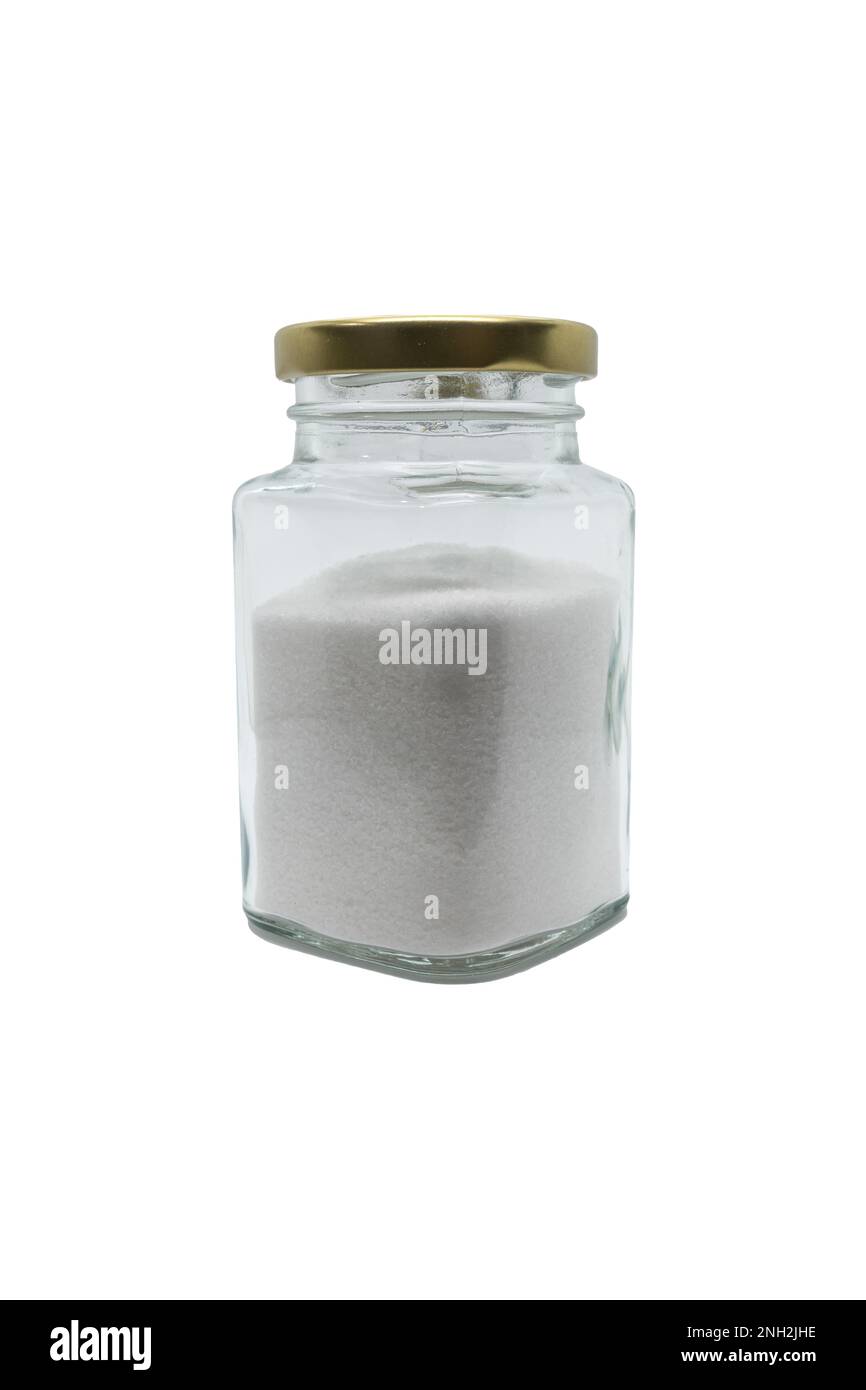 Salt in a glass jar with closed lid. Isolated on white background with ...