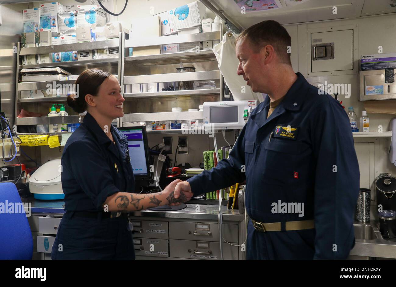 Rear Adm. Kevin Lenox, right, commander, Carrier Strike Group (CSG) 3 ...