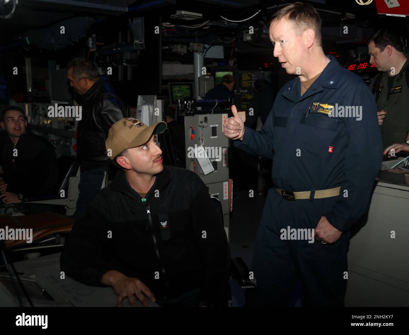 Rear Adm. Kevin Lenox, right commander, Carrier Strike Group (CSG) 3 ...