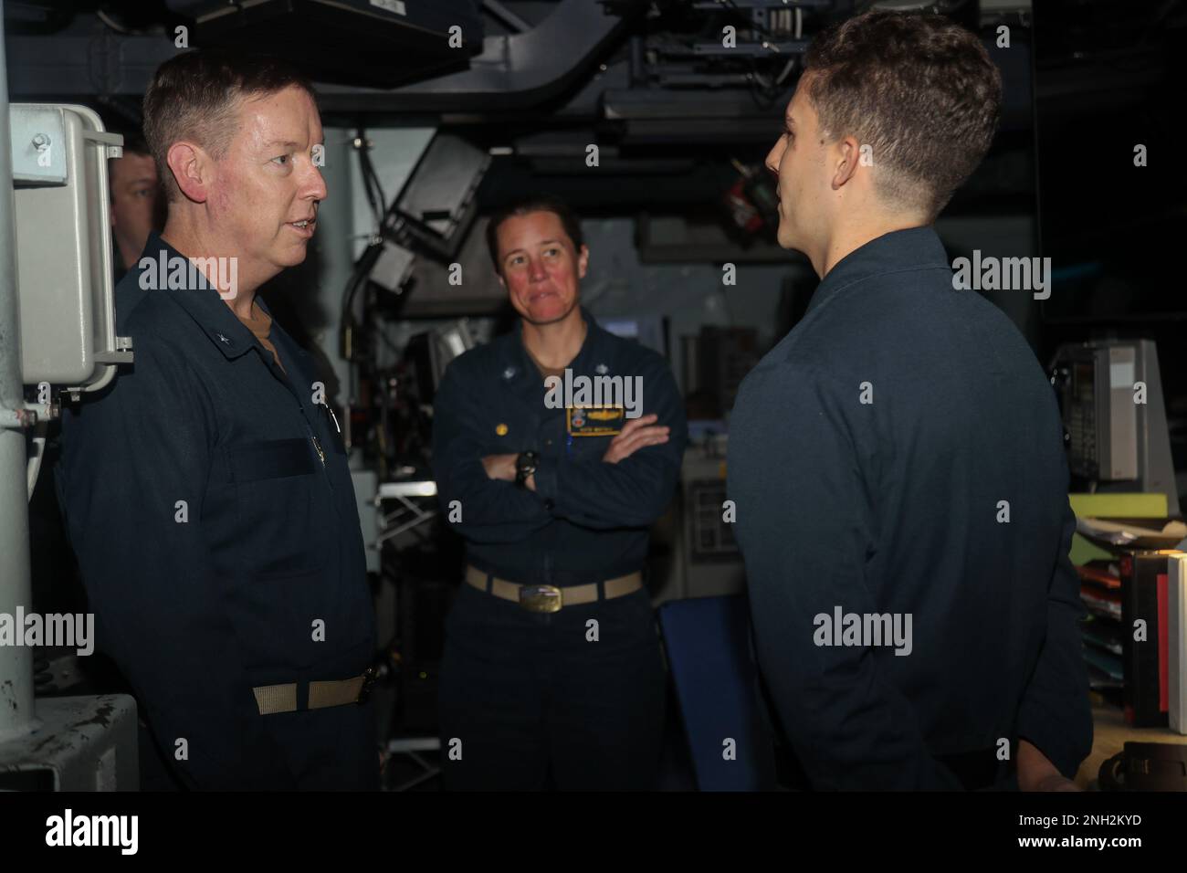 Rear Adm. Kevin Lenox, left, commander, Carrier Strike Group (CSG) 3 ...
