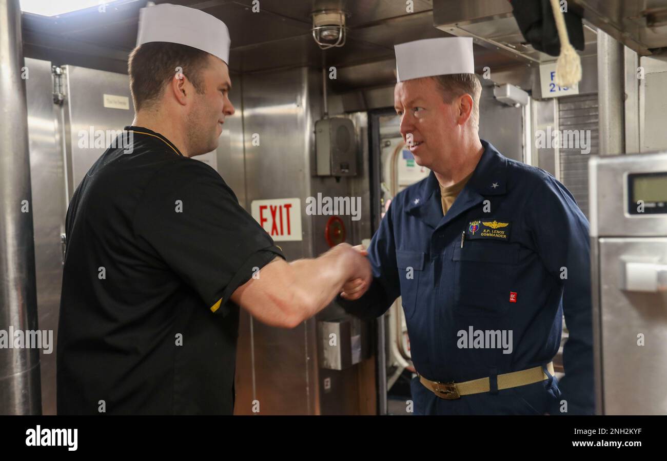 Rear Adm. Kevin Lenox, right commander, Carrier Strike Group (CSG) 3 ...