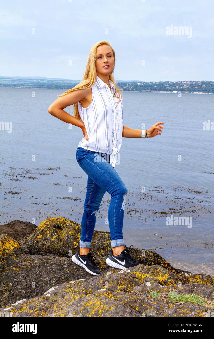 Beautiful female on beach hi-res stock photography and images - Alamy