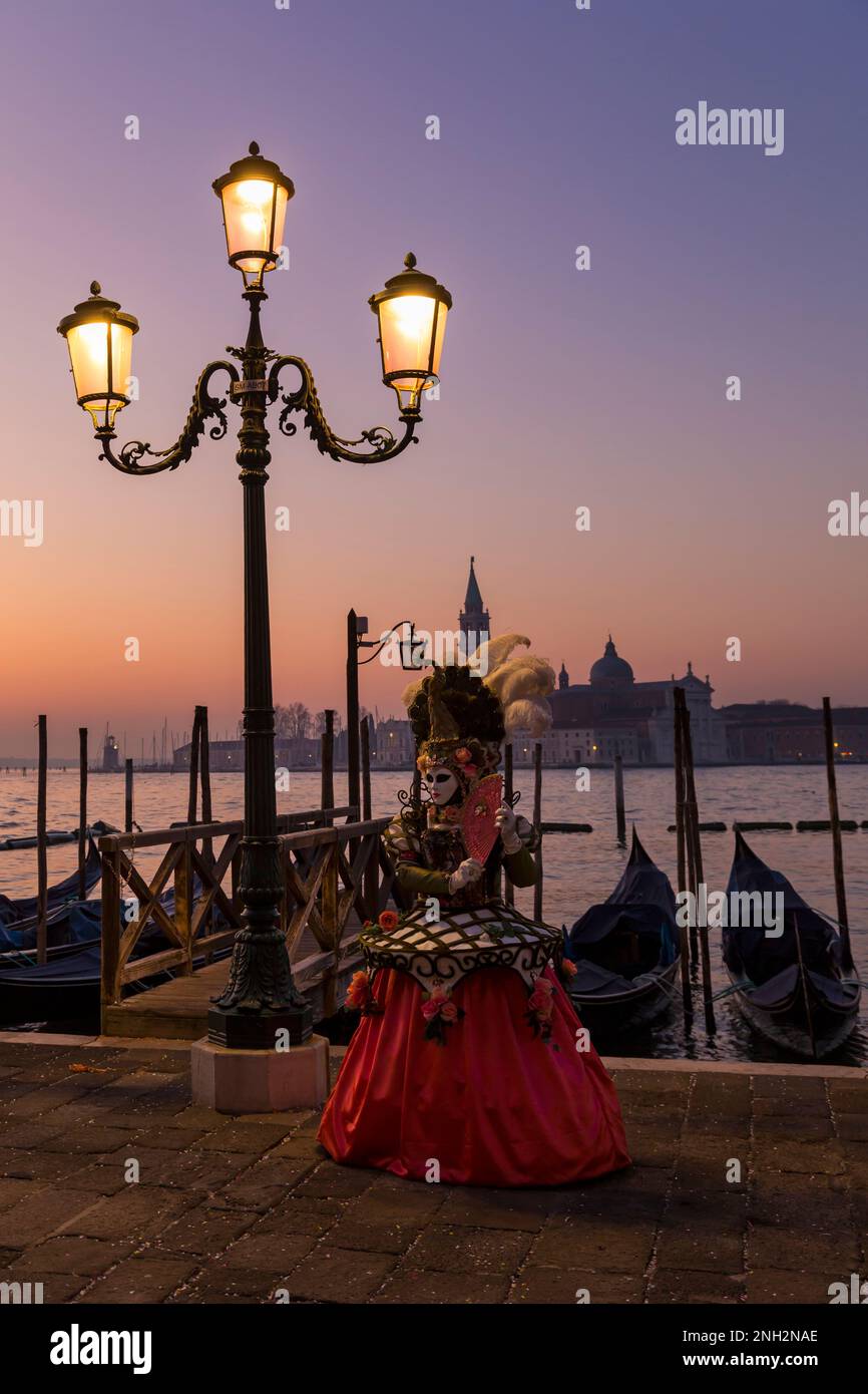 Carnival Goer Dressed In Splendid Costume And Mask During Venice