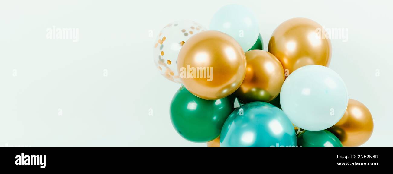 some balloons of different colors forming an elegant arrangement as a ...