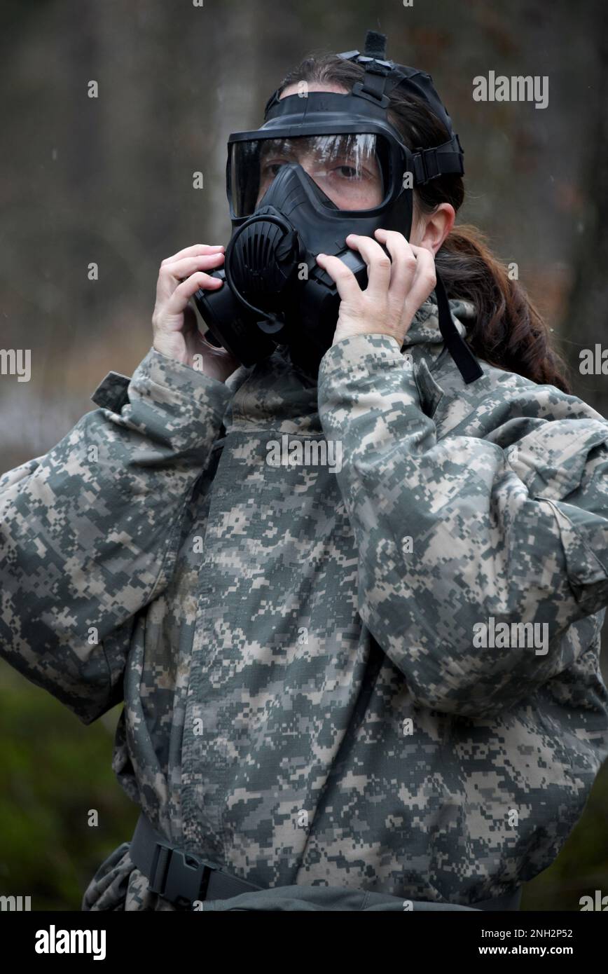 A U.S. Soldier checks the seal of her protection mask during the 7th ...