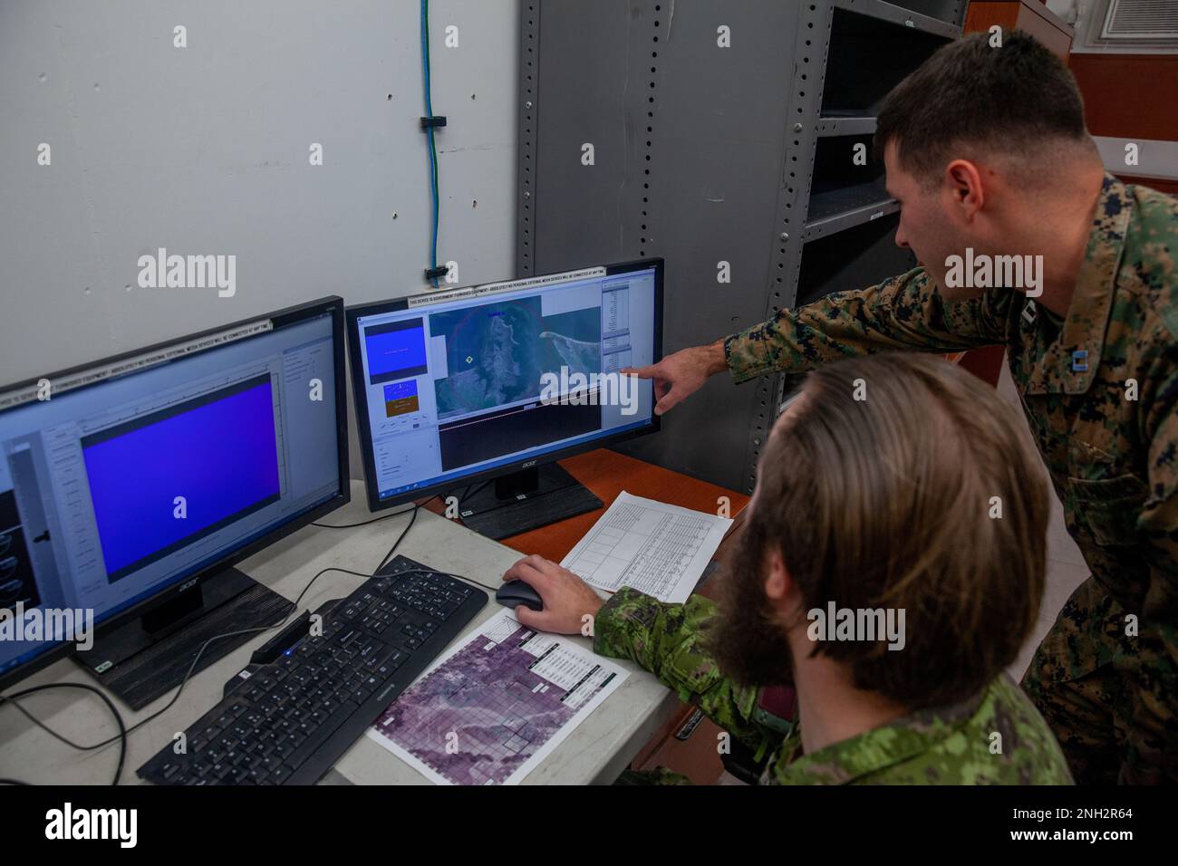 U.S. Marine Corps Capt. Daniel Renner (right), a pilot with Marine ...