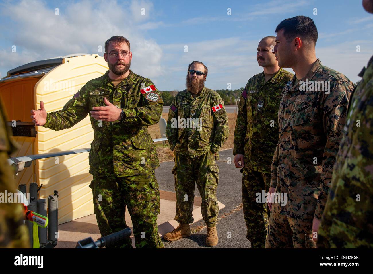U.S. Marine Corps Capt. Daniel Renner (right), a pilot with Marine Unmanned Aerial Vehicle ...