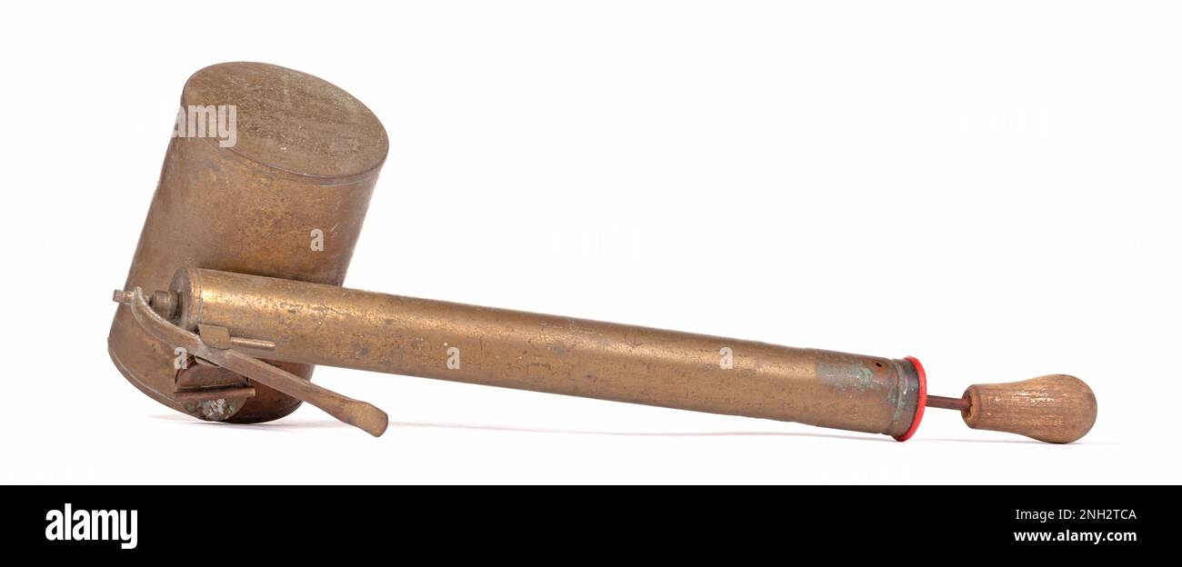Old brass insecticide spray on a white background Stock Photo - Alamy
