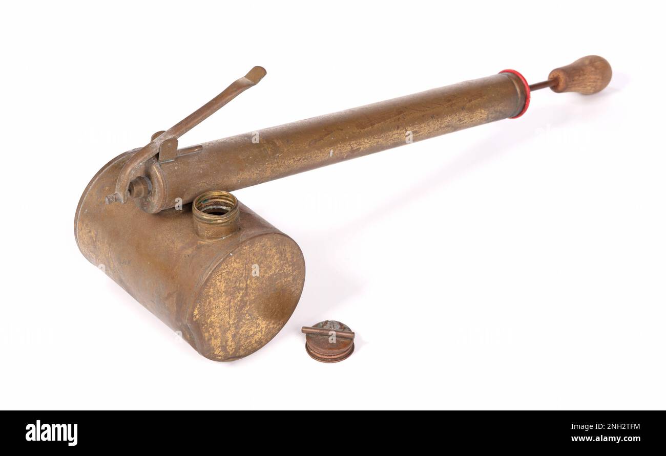 Old brass insecticide spray on a white background Stock Photo - Alamy