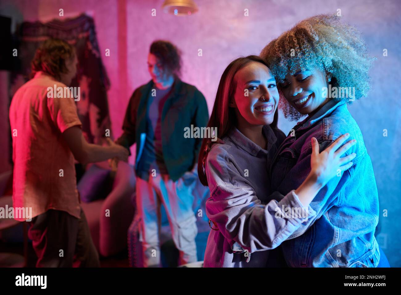 Dancing women happy friends neon hi-res stock photography and images ...