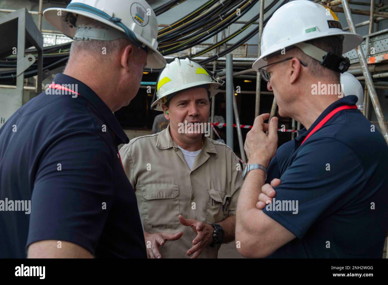 221209-N-JC800-0020 SINGAPORE (Dec. 9, 2022) - (From left) Capt. Robert Williams, Commander ...